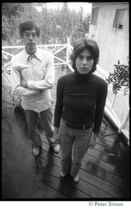 Jake Brackman and unidentified woman standing on a balcony in the Los ...