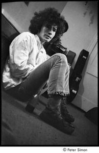 Tim Buckley at the Catacombs: Buckley backstage, seated on the floor ...