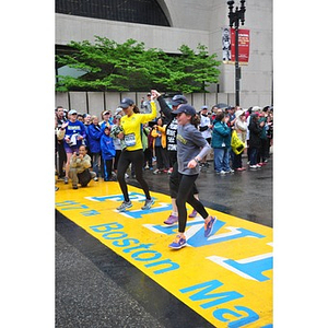 Three women raise hands as they cross One Run finish line - Digital ...