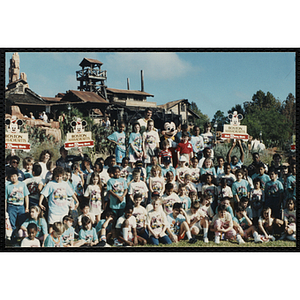 A large group of children and adults pose for a group shot during a ...