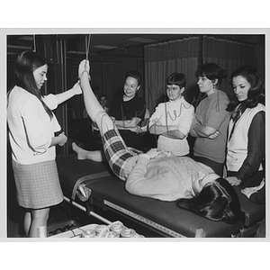 Student conducts a physical therapy demonstration - Digital Commonwealth