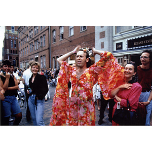 Abe Rybeck standing in crowd wearing a flower crown - Digital Commonwealth
