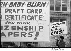 Resistance rally: protestors and counter-protestors holding signs ...