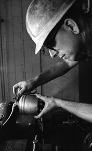 Rodney Hunt worker with an oil can - Digital Commonwealth