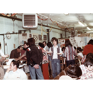 Man stands next to a buffet at Chinese Progressive Association's First ...