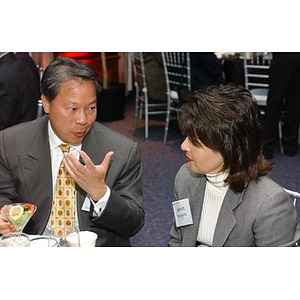 Jeanne Sargent and a man converse at The National Council Dinner ...