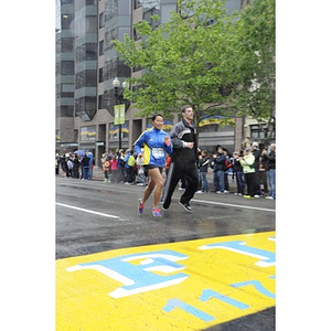 Two runners at One Run near the Finish line - Digital Commonwealth