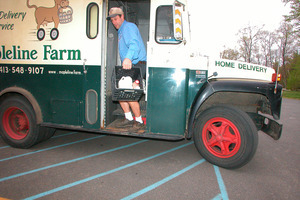 Mapleline Farm delivery man exiting his truck - Digital Commonwealth