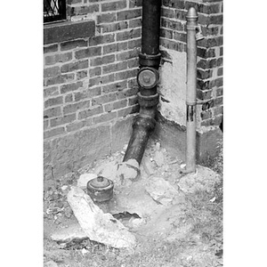 Pipe on the exterior of a building. - Digital Commonwealth