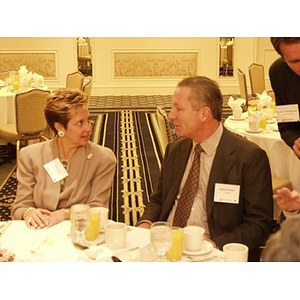 Guests speaking at a table prior to the College of Business ...