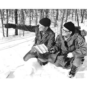 Two ROTC cadets read a map - Digital Commonwealth