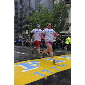 "One Run" participants cross the finish line by Marathon Sports in ...