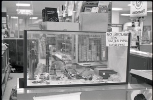 Head shop with sign at counter reading "No return on water pipes or ...
