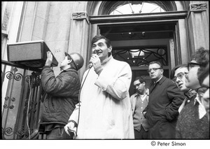 Howard Zinn speaks at a demonstration, Raymond Mungo third from right ...