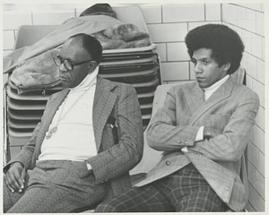 Two men leaning back in their chairs - Digital Commonwealth