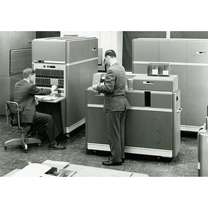 Professors (?) operating Northeastern University's first computer, 650 ...